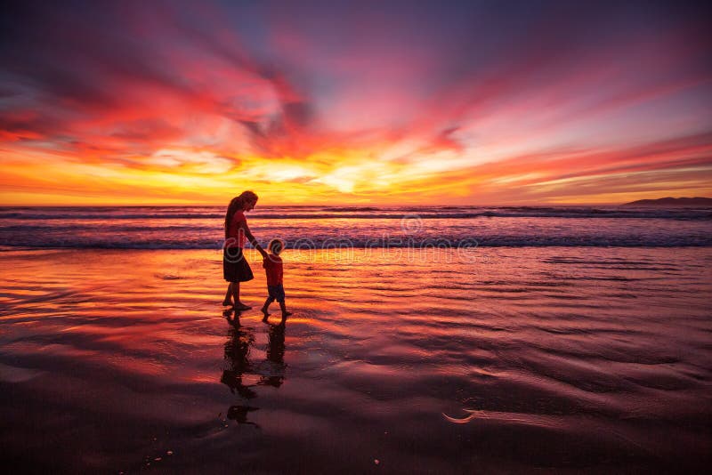 Mother and Son Having Fun at Sunset on the Beach Stock Image - Image of ...