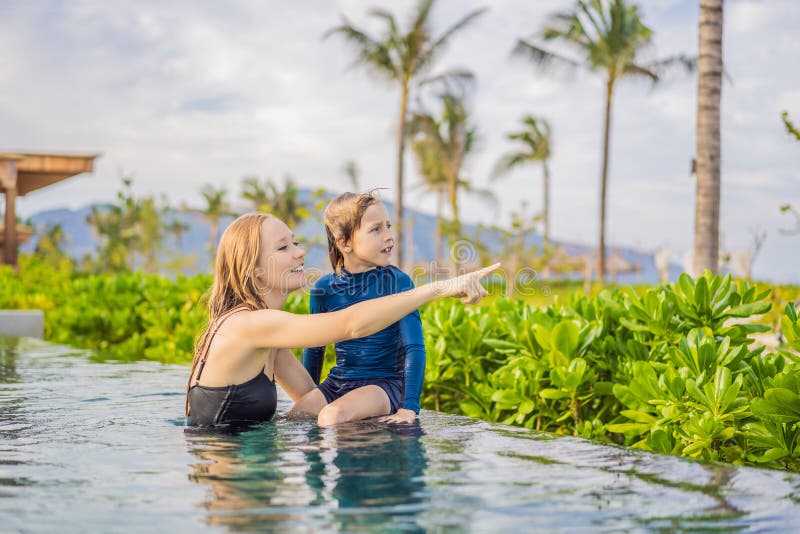 Mother and Son Having Fun in the Swimming Pool Stock Photo - Image of ...
