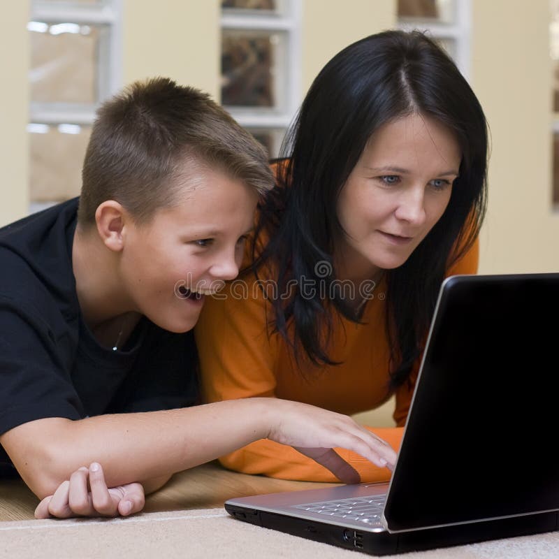 Mother and son with laptop stock image. Image of excited - 6393167