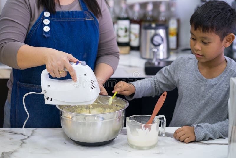 Mother and Son Making a Cake Stock Photo - Image of family, baking ...