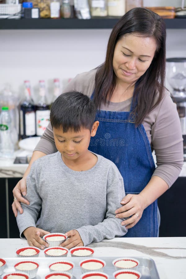 Mother and Son Making a Cake Stock Photo - Image of together, childhood ...