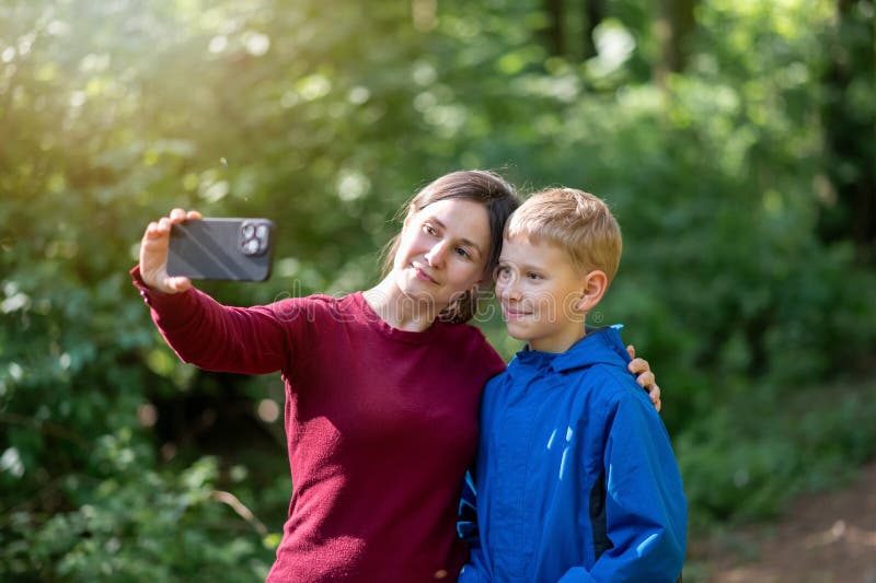 Mother and Son Making Funny Faces while Taking a Selfie during a Spring ...