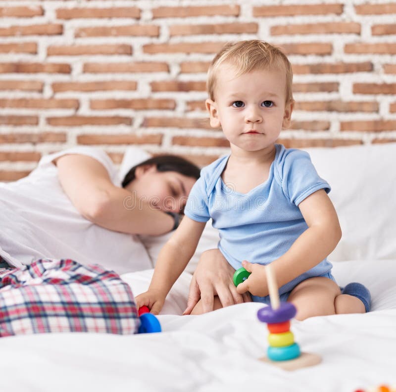 Mother and Son Playing on Bed and Sleeping at Bedroom Stock Photo ...