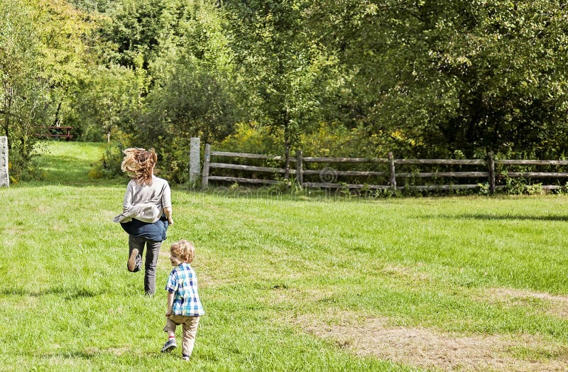 Mother and Son Playing Chase Stock Photo - Image of sweet, outdoors ...