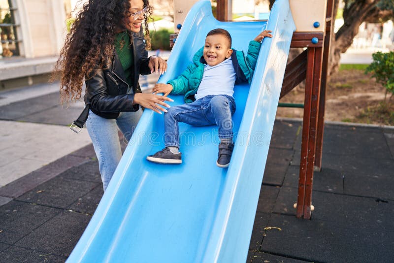 Mother and Son Playing on Slide at Park Stock Photo - Image of children ...