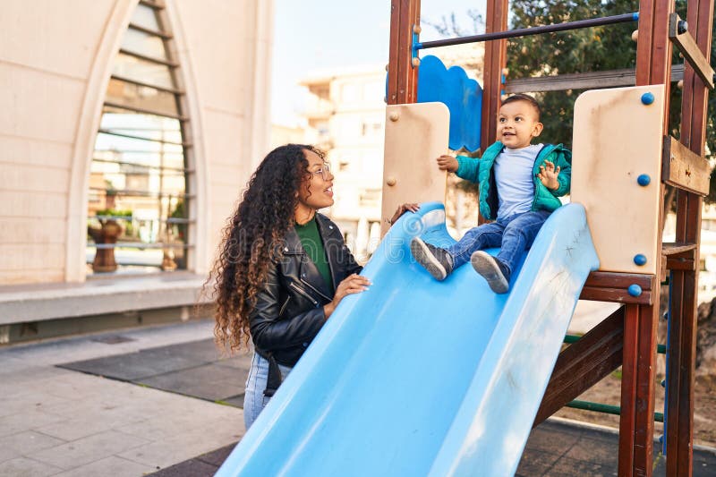 Mother and Son Playing on Slide at Park Stock Photo - Image of happy ...