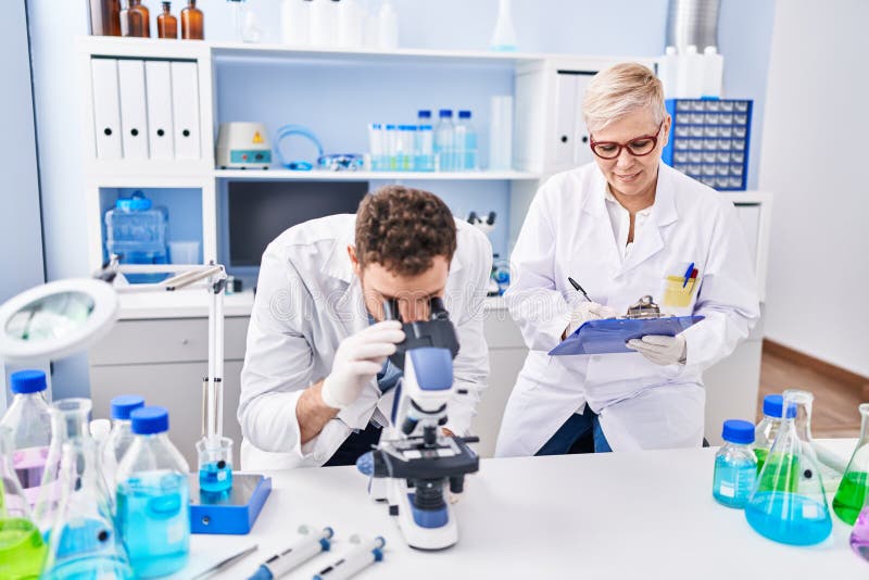 Mother and Son Scientist Partners Working at Laboratory Stock Image ...