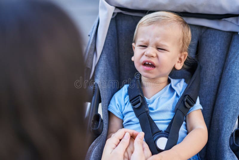 Mother and Son Sitting on Stroller Baby Crying at Street Stock Photo ...