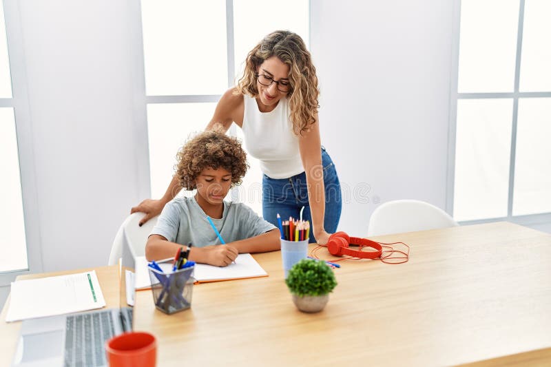 Mother and Son Smiling Confident Doing Homework at Office Stock Photo ...