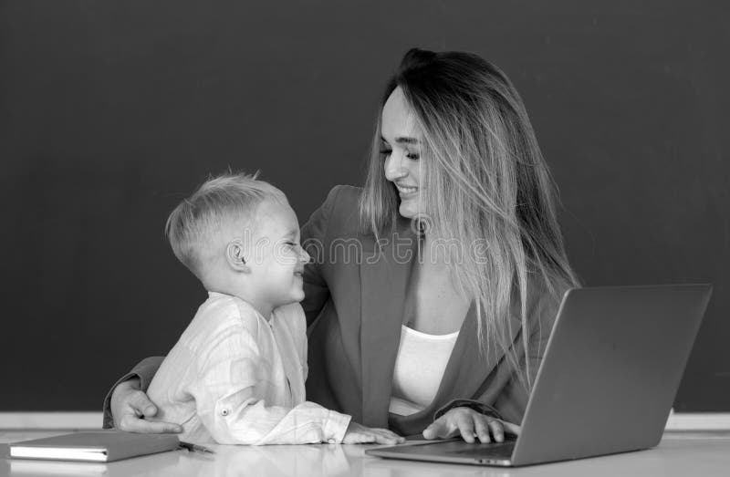 Mother and Son Together Using Computer Laptop. Elementary School ...