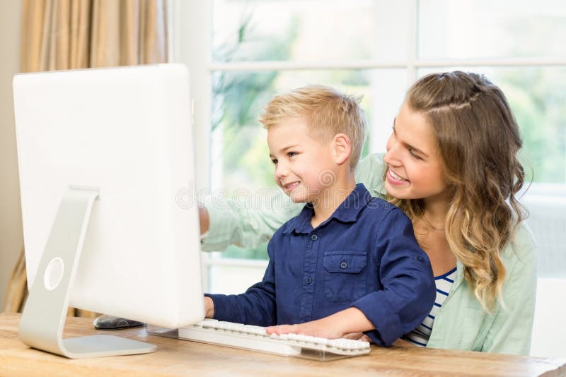 Mother and Son Using the Computer Stock Image - Image of household, electronic: 65323537