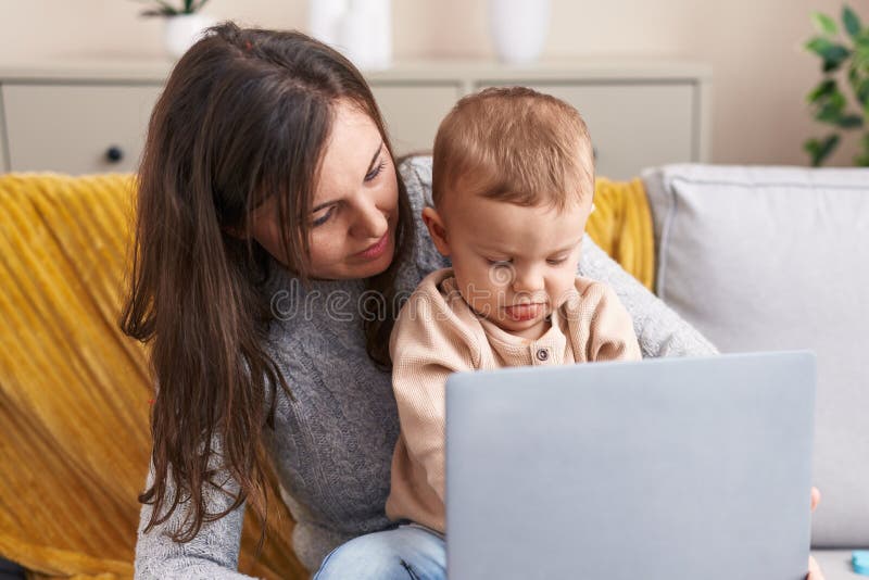 Mother and Son Using Laptop Sitting on Sofa at Home Stock Image - Image of lifestyle, female ...