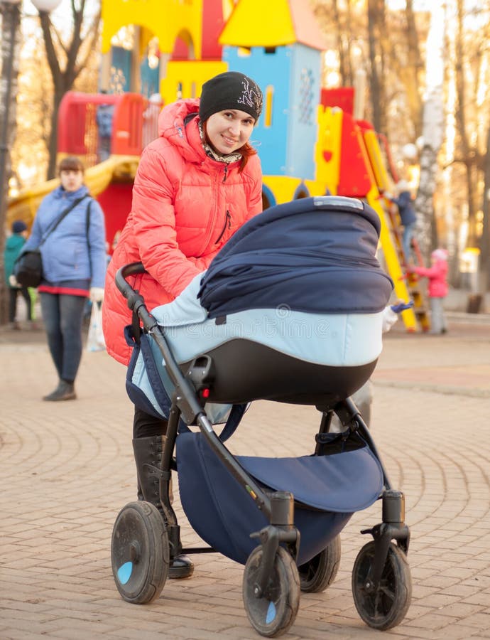 Mother with stroller stock image. Image of carriage, parent - 51693695
