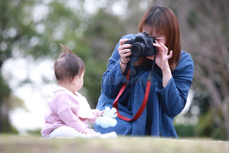 Mother Taking Pictures of Baby Stock Image - Image of woman, family ...