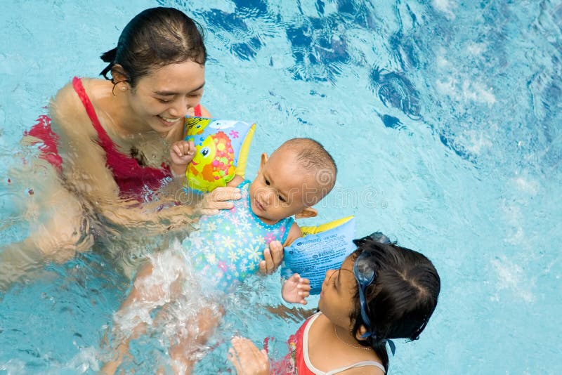 Mother teach baby to swim stock image. Image of swimming - 11570985