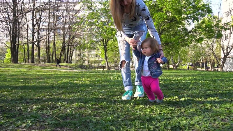 Mother Teaching Her Baby First Steps in Slow Motion Stock Video - Video ...