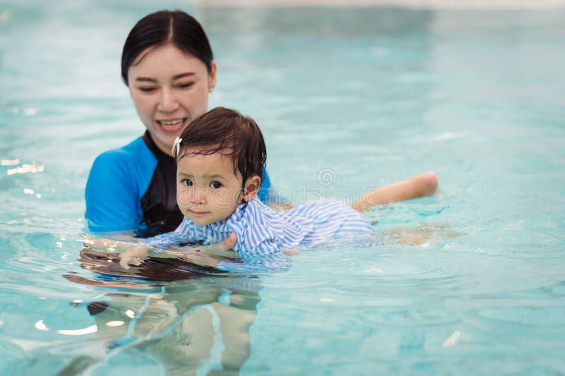 Mother Teaching Her Daughter Swimming in Pool Stock Image - Image of ... Mother Teaching Her Daughter Swimming in Pool Stock Image - Image of ...