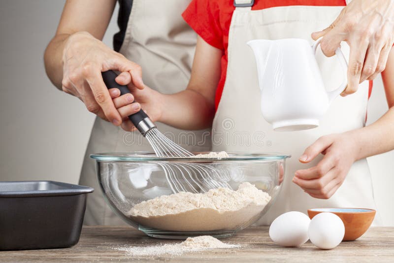 A Mother is Teaching Her Little Daughter How To Cook. Stock Photo ... A Mother is Teaching Her Little Daughter How To Cook. Stock Photo ...