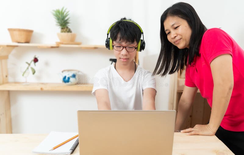 Mother is Teaching Her Son, Studying Online Stock Image - Image of ...