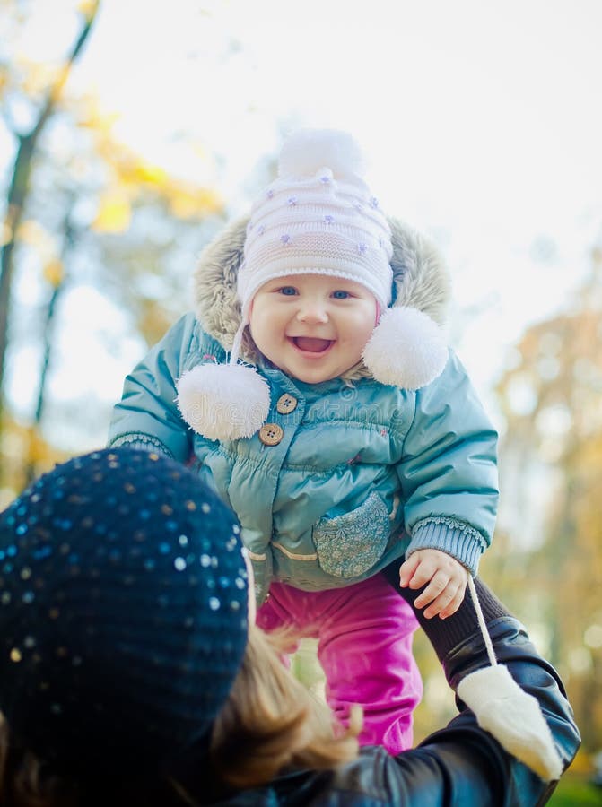Mother Tossing Up Her Daughter Stock Photo - Image of affectionate ...