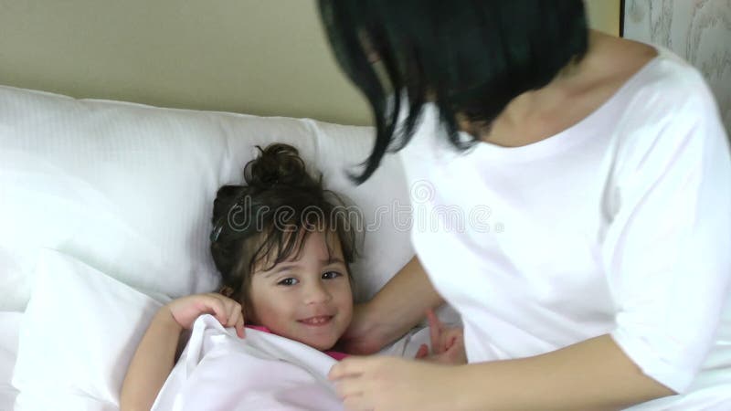 Mother Tucking Children into Bed for a Restful Sleep Stock Video ...