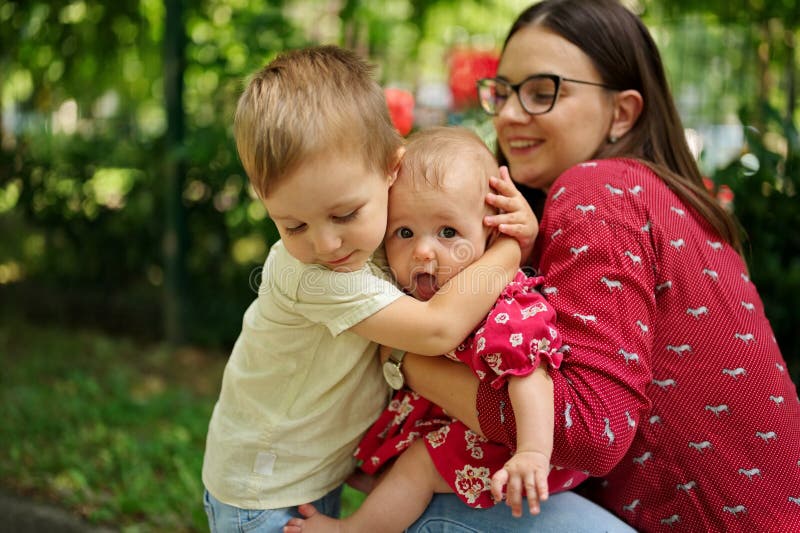 Children Cuddling on Their Fathers Back Joyfully Stock Image - Image of ...
