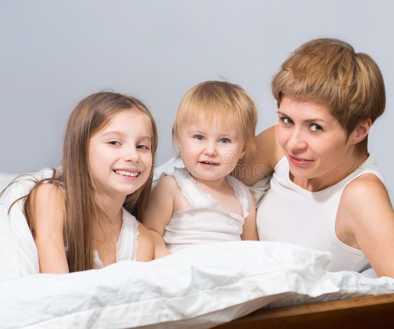 Mother with two children stock image. Image of isolated - 45155951
