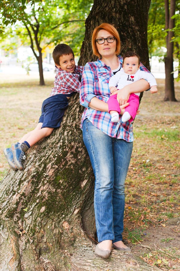 Mother with two children stock image. Image of female - 36533847