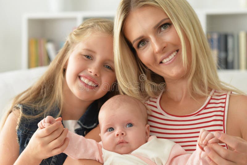 Mother with two daughters stock photo. Image of mother - 85825172