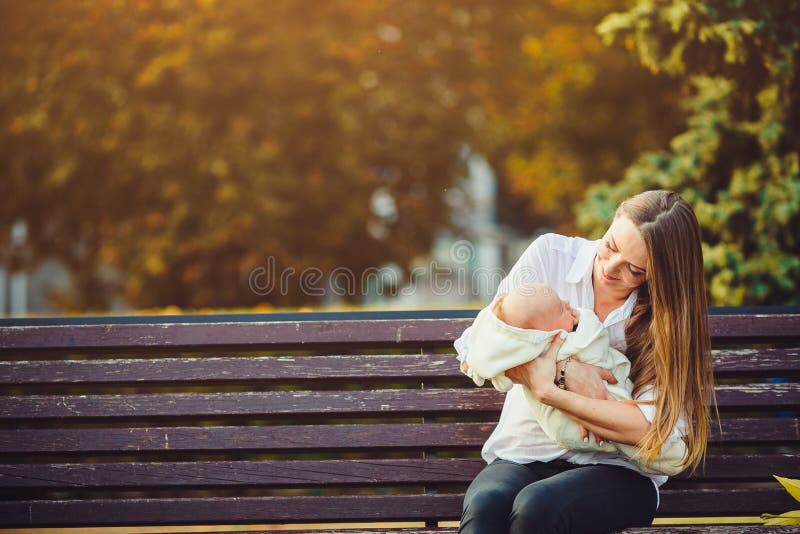 Mother and Two Daughters Rest on a Bench Stock Image - Image of concept ...