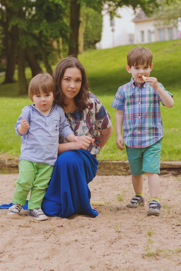 Mother with Two Sons Outdoor Stock Image - Image of mother, break: 62208321
