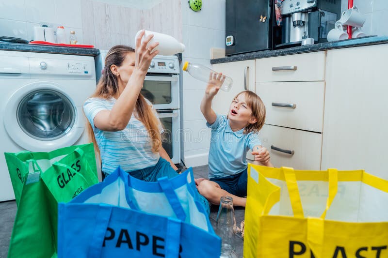 Mother Using Game is Teaching Kid How To Recycle Help the Boy Aware ...