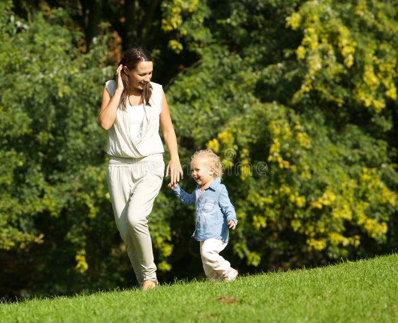 Mother Walking Outdoors with Baby Stock Image - Image of happiness ...