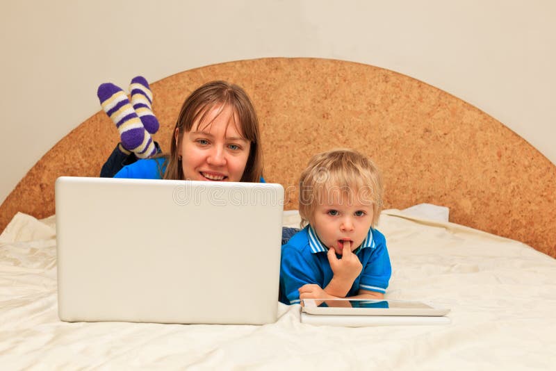 Mother working from home stock photo. Image of communication - 28888444