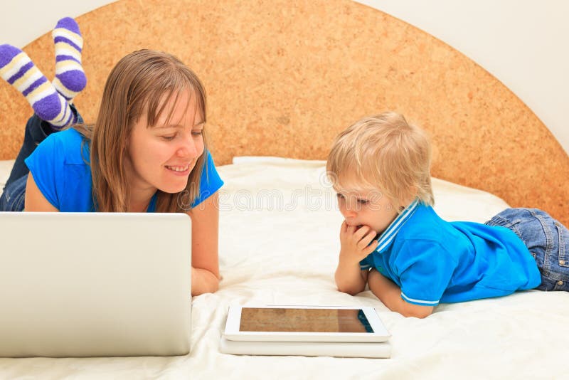 Mother working from home stock image. Image of laptop - 29567991
