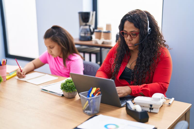 Mother and Young Daughter at the Office Working and Doing Homework ...