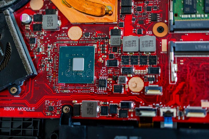 A Motherboard with Intricate Circuit Patterns, RAM Modules, and Various ...