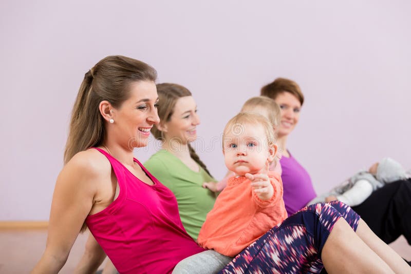 Mothers Exercising with Babies at Postnatal Exercise Course Stock Image ...