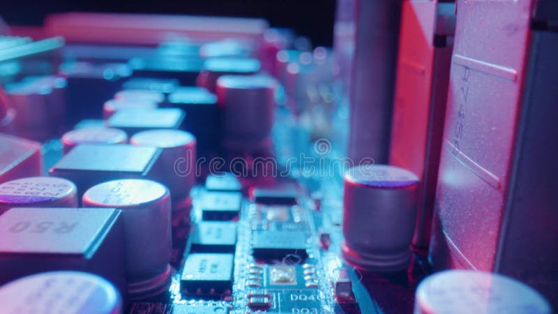 Motion Above Computer Motherboard at Purple and Blue Light Stock ...