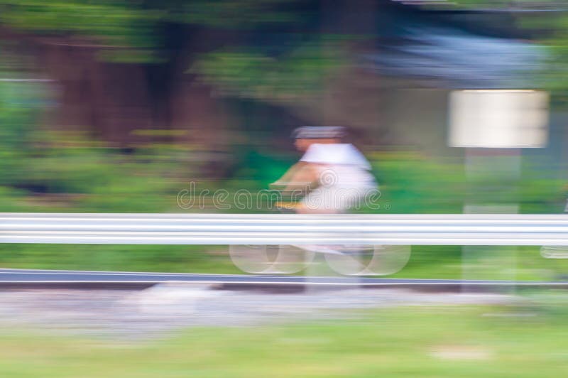 Motion Blur of Cyclist Riding a Bike Stock Image - Image of helmet ...