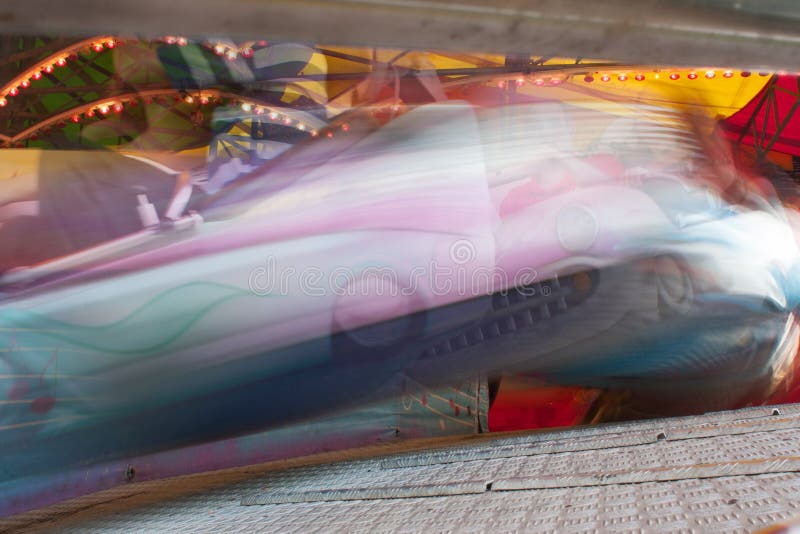 Motion Blur of People Riding Fast Carnival Ride Editorial Stock Image ...