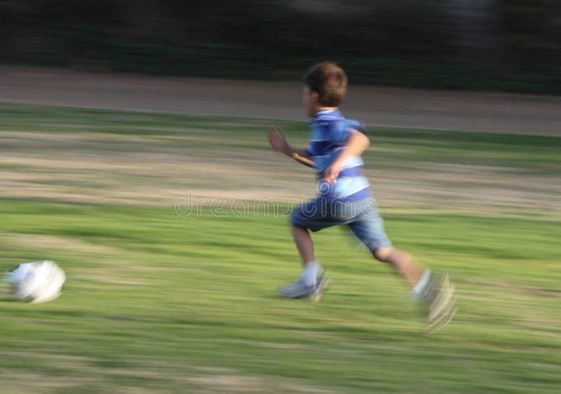 Motion Blurred Boy Running Fast Stock Photo - Image of coastline ...