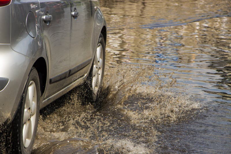 Motion Car Rain Big Puddle of Water Spray from the Wheels Stock Image ...