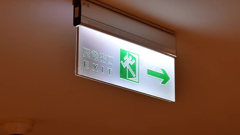 Motion of Emergency Exit Sign on Ceiling Inside Shopping Mall Stock ...