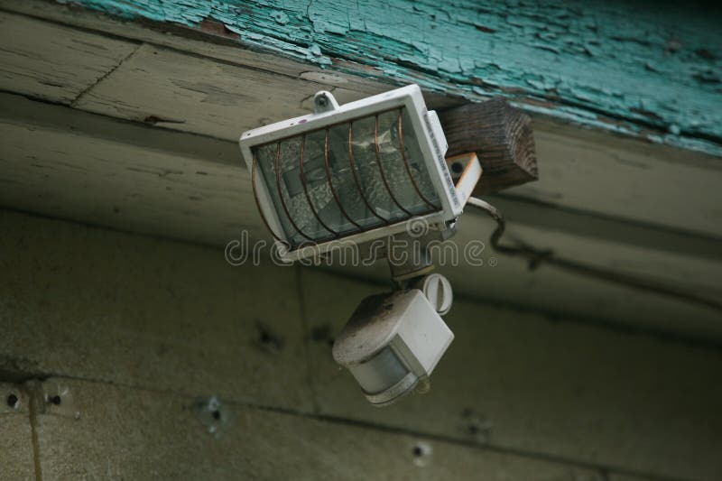 Motion Sensor and LED Spotlight on the Wall of the Building. Automatic ...