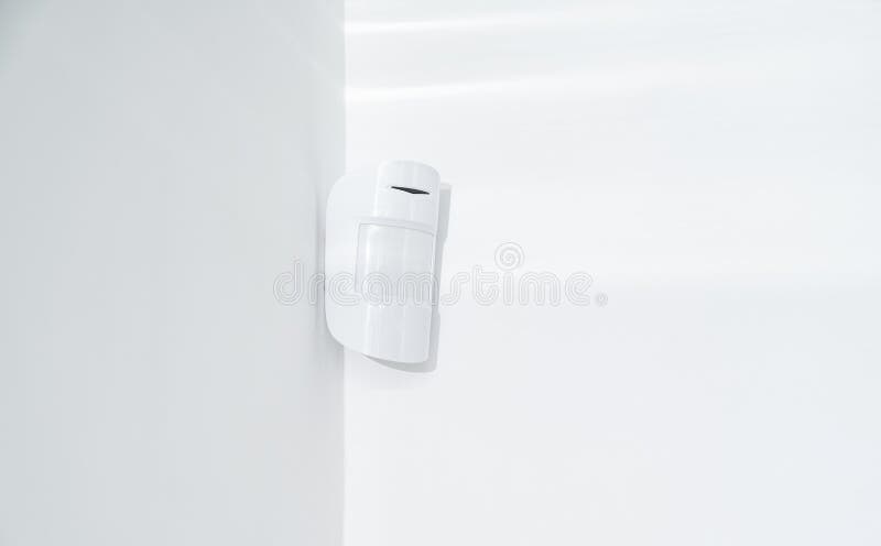 Motion Sensor in the White Corner. Device that Tracks Movement of ...