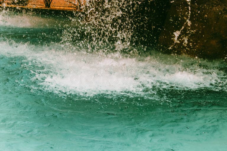 In Motion Turquoise Splash Droplets in a Swimming Pool Water Park ...