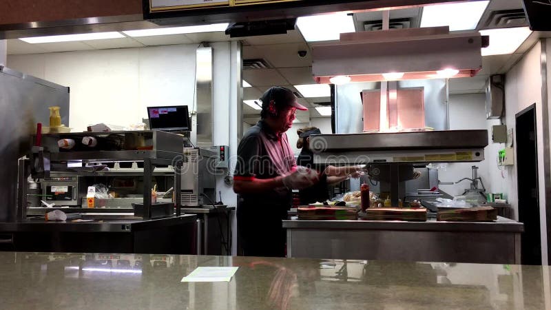 Worker Making Burgers for the Customer Inside Burger Kings Stock ...