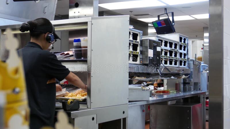 Worker Making Burgers for the Customer Inside Burger Kings Stock ...