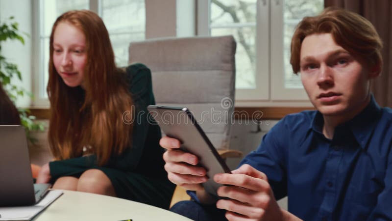 Motivated Young People, Students Sitting at Table with Laptops, Doing ...